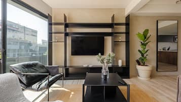Apartamento elite | Área de estar | Smart TV 40 polegadas com canais a cabo
