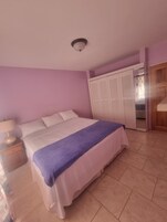 Apartamento família, 2 quartos, para não fumantes, acesso à piscina | 2 quartos, ferros/tábuas de passar roupa, Wi-Fi de cortesia