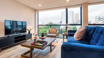 Apartamento Exclusivo | Sala de estar | Smart TV de 50 polegadas com canais digitais