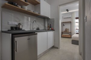 Suite, 1 quarto | Ferro/tábua de engomar, Wi-fi grátis, roupa de cama fornecida 