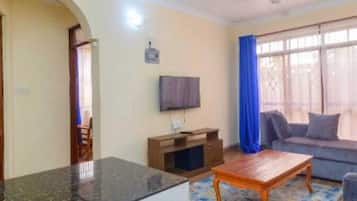 Apartamento Comfort | Sala de estar | Smart TV de 24 polegadas com canais digitais