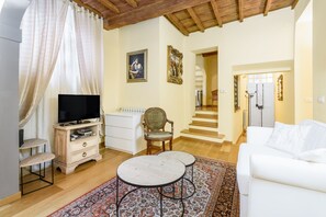 Apartamento conforto | Área de estar | TV de tela plana 40 polegadas com canais digitais