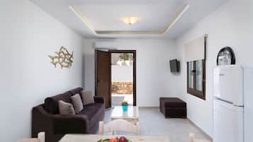 Apartamento conforto | Área de estar | Smart TV 32 polegadas com canais via satélite