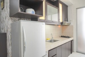 Apartamento | Cozinha privada | Um frigorífico/congelador grande, uma placa de cozinha 