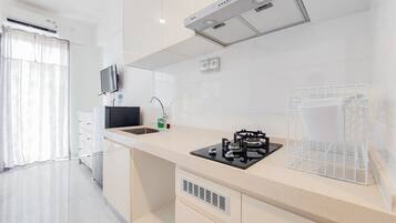 Estúdio | Cozinha privada | Geladeira, cooktop, panela elétrica de arroz