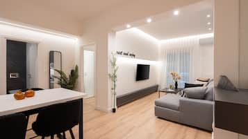 Apartamento exclusivo | Área de estar | Smart TV 55 polegadas com canais a cabo