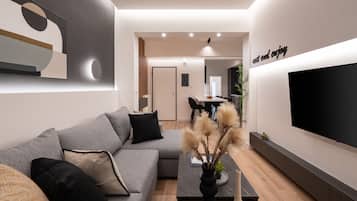 Apartamento exclusivo | Área de estar | Smart TV 55 polegadas com canais a cabo