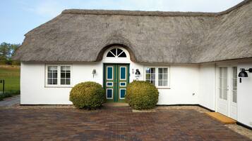 Suite Deluxe, vista para o oceano | Secretária, secretária adequada para computadores portáteis