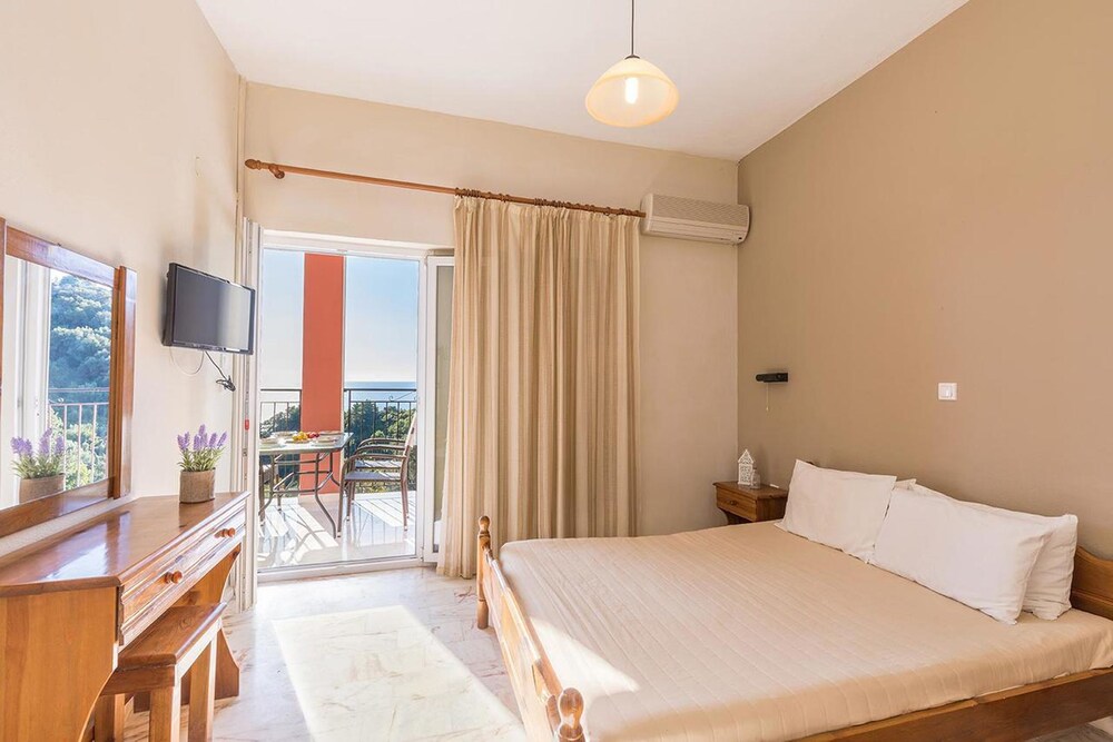 Pool Apartments with panoramic Pelekas Beach view - Parelia | Vrbo