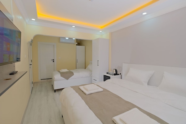 Suíte família | Roupas de cama premium, frigobar, cofres nos quartos, Wi-Fi de cortesia