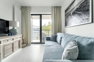 Apartamento luxo | Área de estar | TV de tela plana