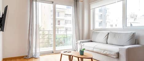 Apartamento luxo | Área de estar | TV LED 42 polegadas com canais a cabo