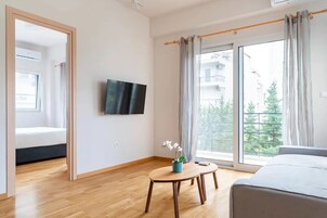 Apartamento luxo | Área de estar | TV LED 42 polegadas com canais a cabo