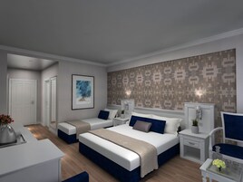 Quarto moderno com cama grande, mesas de cabeceira e uma obra de arte na parede.