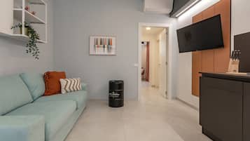 Quarto Cidade | Sala de estar | Smart TV de 75 polegadas com canais via satélite