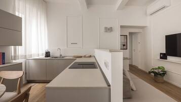 Apartamento design | Área de estar | TV de tela plana 40 polegadas com canais digitais