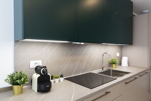 Apartamento Panorâmico | Cozinha privada | Um frigorífico/congelador grande, um micro-ondas, um forno 