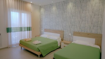 Apartamento Deluxe | 1 quarto, edredões de penas, cortinas/cortinados opacos 