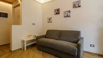 Apartamento conforto, vista para o vinhedo | Área de estar