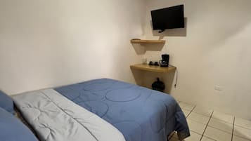 Quarto Básico | 1 quarto, minibar, Wi-fi grátis
