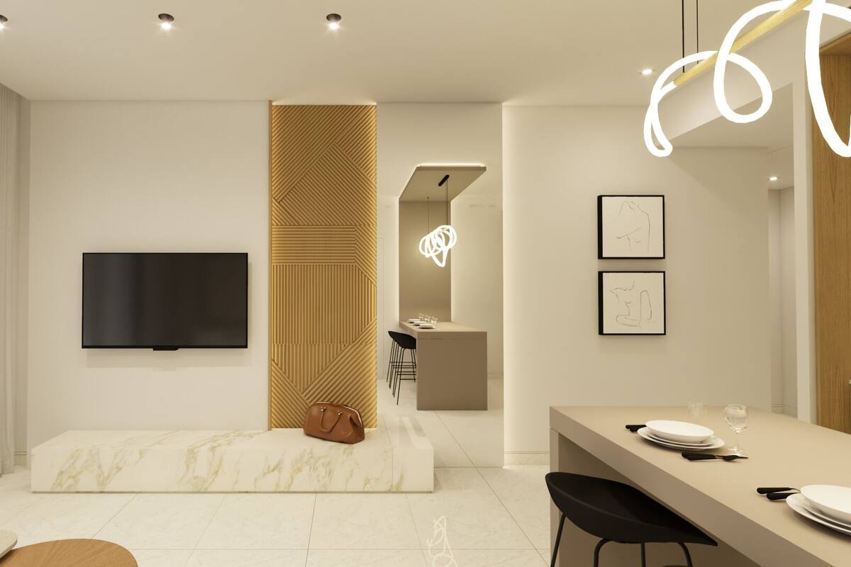 Uma sala de estar moderna com televisão de tela plana na parede, área de estar com sofá e mesa de centro, área de jantar com balcão, e cozinha visível ao fundo.