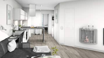 Um apartamento moderno com cozinha, sala de jantar e sala de estar.