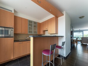 Apartamento | Cozinha privada | Chaleira elétrica, torradeira