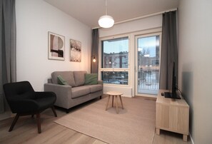 Apartamento econômico | Área de estar | TV 32 polegadas com canais a cabo