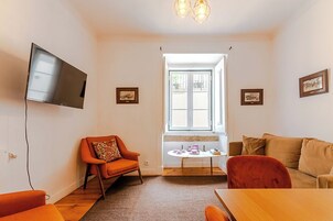 Apartamento superior | Área de estar | TV de tela plana