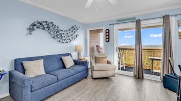 Apartamento Signature em Condomínio Fechado, vista para a praia | Sala | Smart TV de 55 polegadas com canais digitais