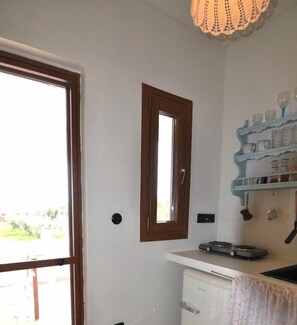 Apartamento Deluxe, varanda, vista para a praia | Cozinha privada