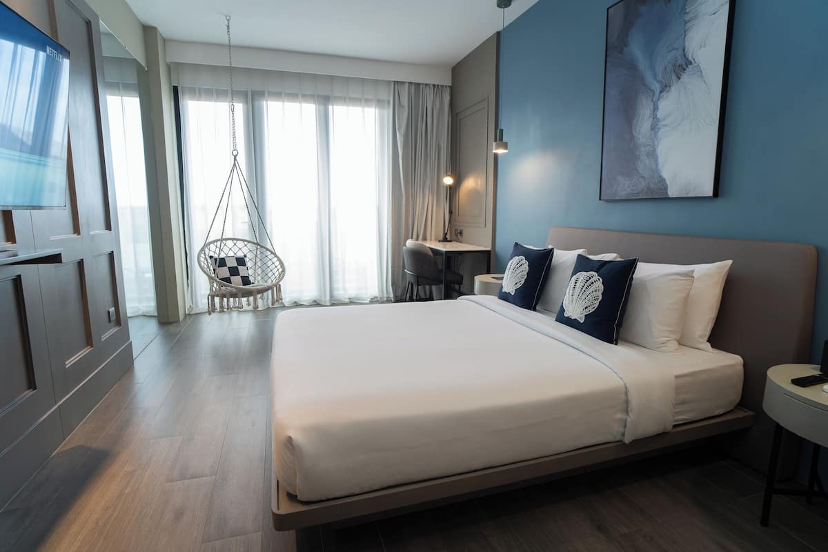 Quarto Deluxe, vista para o oceano | Roupa de alta qualidade, minibar com produtos grátis, secretária