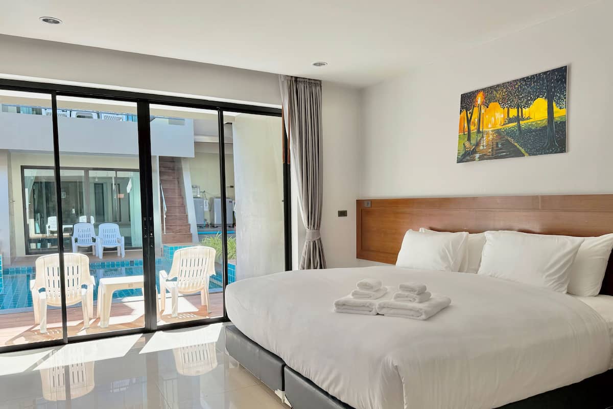 Quarto Deluxe, acesso à piscina | Vista do quarto