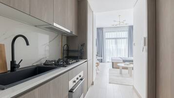 Apartamento conforto, sacada, vista para a cidade | Cozinha privada
