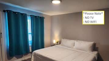 Quarto standard, 1 cama King, vista parcial para o lago, no piso térreo | Wi-Fi, roupa de cama