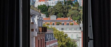 Quarto quádruplo família, vista para a cidade | Área de estar