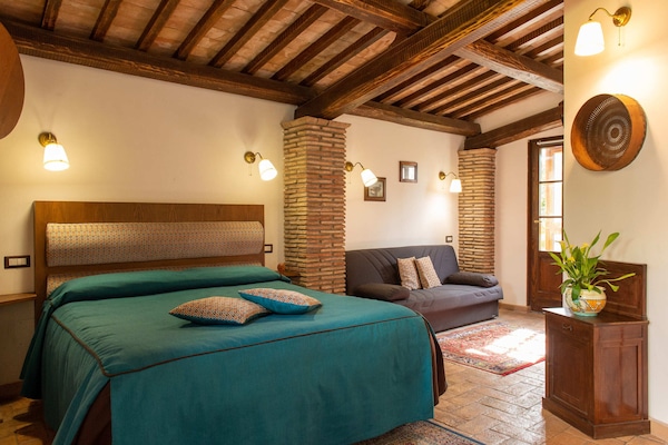 Quarto triplo, vista para o jardim