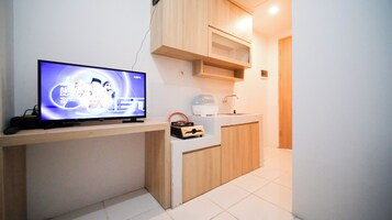 Apartamento Deluxe | Sala de estar | Escritórios 