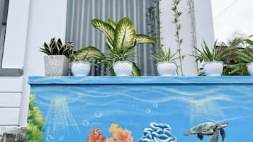Quarto casal, 2 camas de casal, vista para o mar | Terraço/pátio