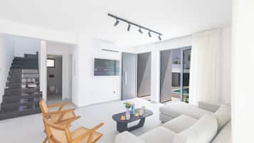 Vila, 4 quartos, piscina particular, vista para o jardim | Área de estar