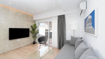 Apartamento de Luxo | Sala | Televisor de 50 polegadas com canais por cabo