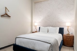 Quarto luxo | 1 quarto, roupas de cama premium, cortinas blackout