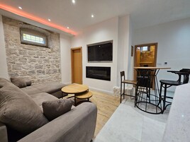 Apartamento | Área de estar | TV LED 139 cm com canais a cabo