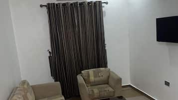 Quarto casal executivo, 1 cama King | Área de estar