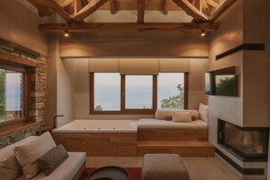 Suite-Estúdio Lua de Mel | Sala de estar | Televisor 