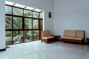 Quarto Duplo Deluxe | Sala de estar