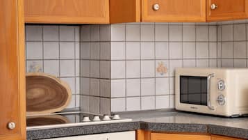 Suite Deluxe | Cozinha privada | Uma máquina de café expresso, uma cafeteira/bule, uma chaleira elétrica