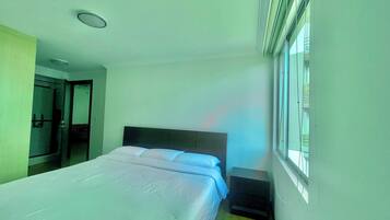 Apartamento Comfort, 2 quartos, Vista para a cidade | 2 quartos, cortinas/cortinados opacos, ferro/tábua de engomar