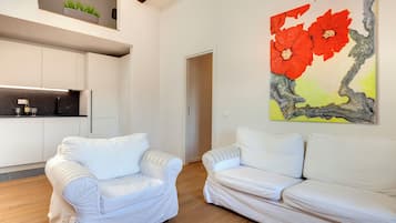 Apartamento | Sala de estar | Televisor de ecrã plano de 40 polegadas com canais digitais