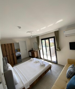 Quarto Quádruplo Deluxe, varanda, vista para o jardim | Vista do quarto